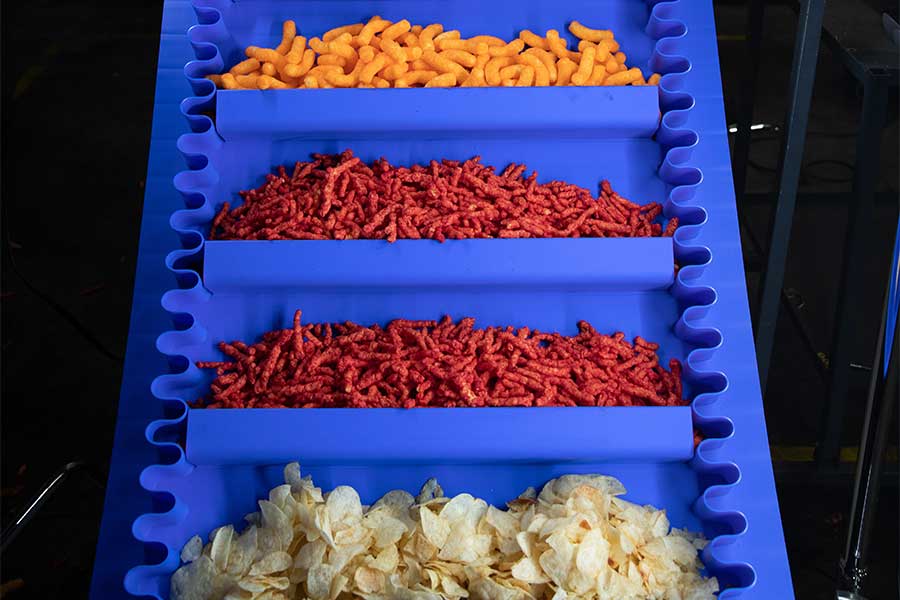 A23 Material Extends Belt Life on Snack Inclines | Intralox